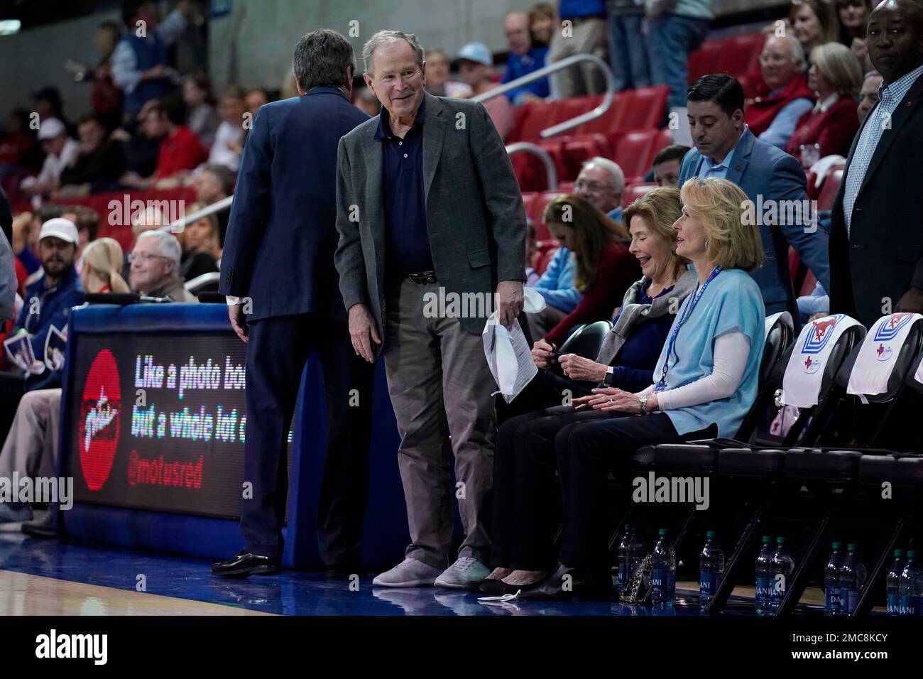 Former President George W. Bush attends an NCAA college basketball game ...