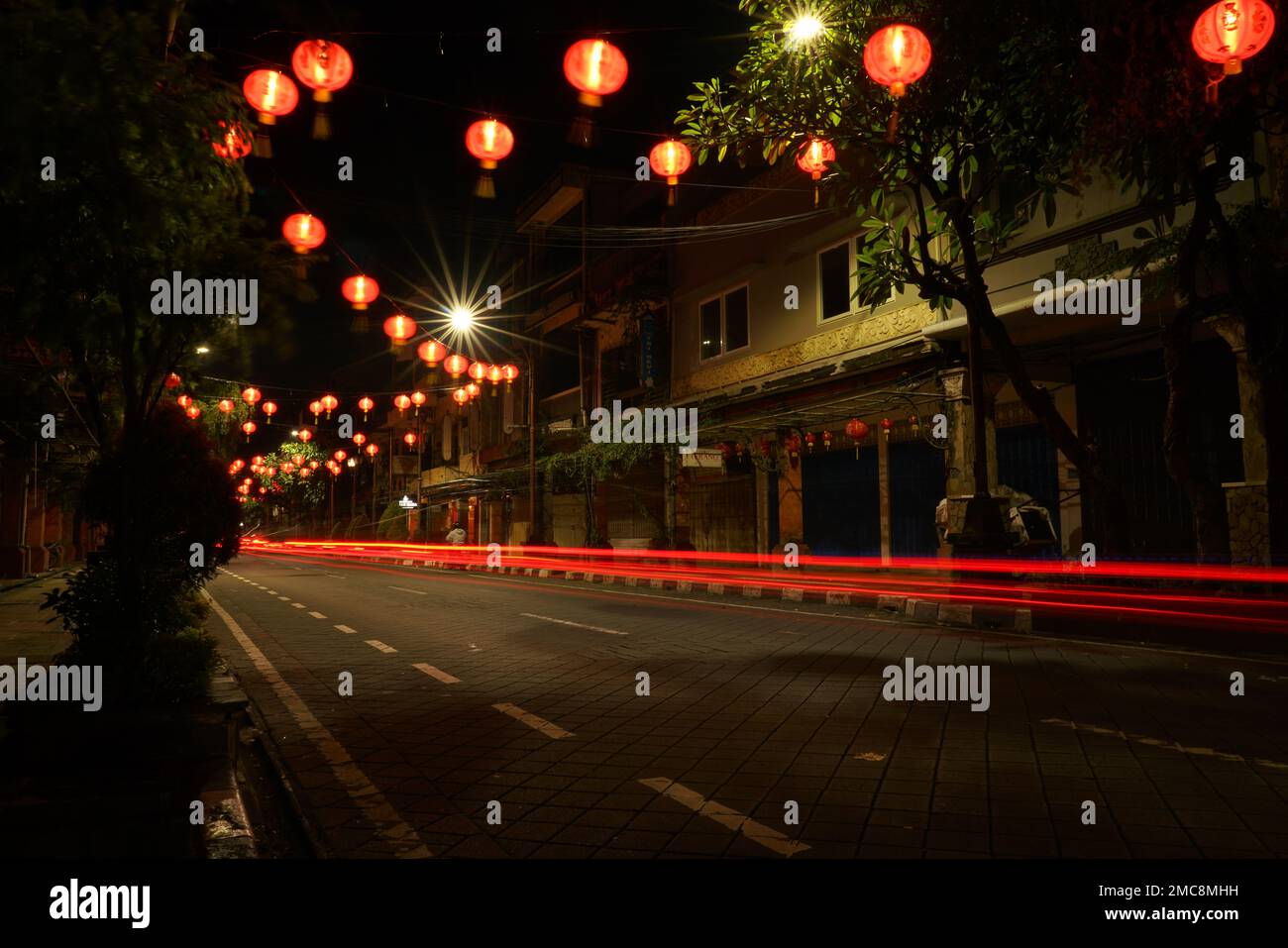 Light trails and lanterns blend in the darkness of the lunar new year's ...