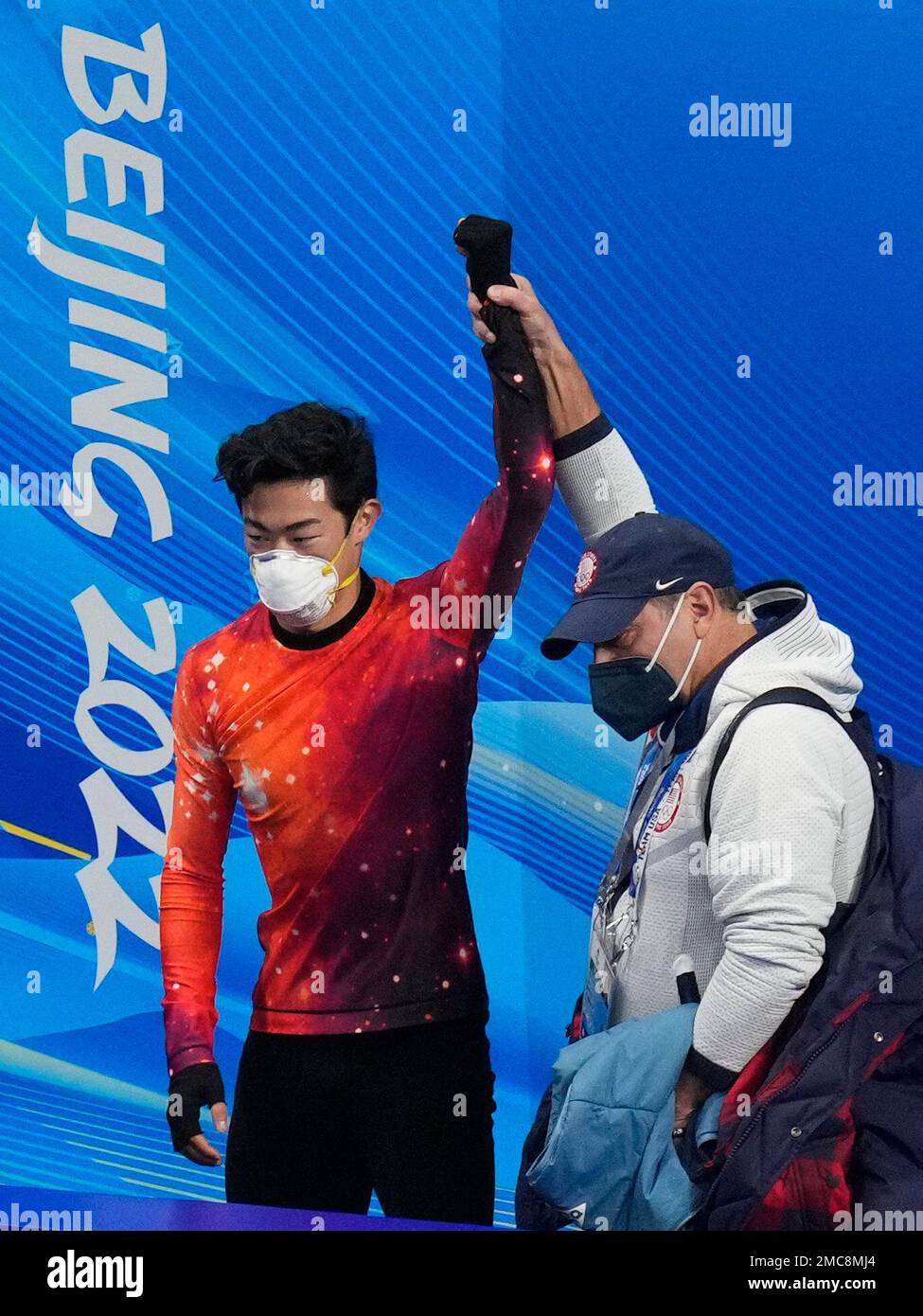 Nathan Chen, left, of the United States, celebrates after winning the ...