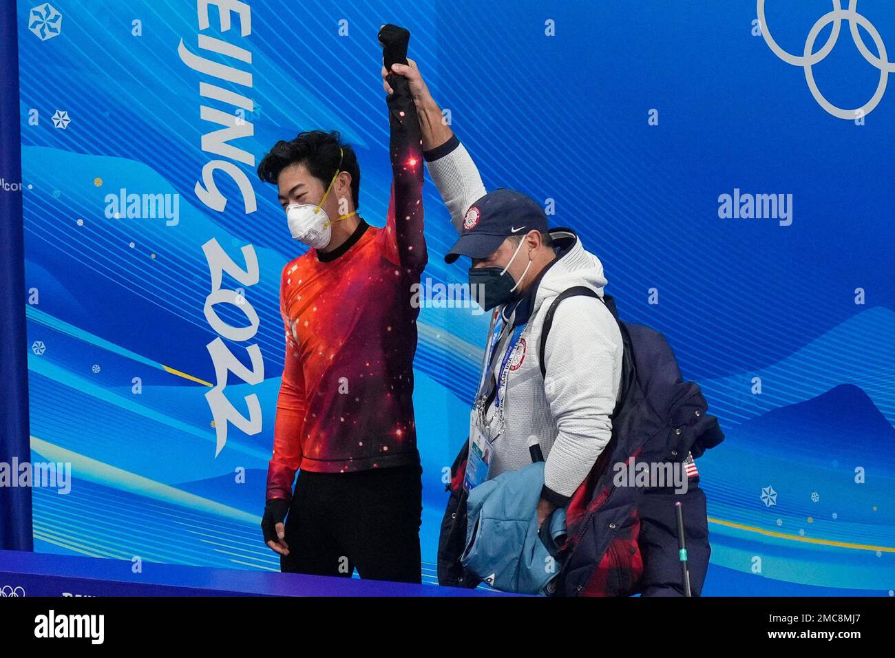 Nathan Chen, left, of the United States, celebrates after winning the ...