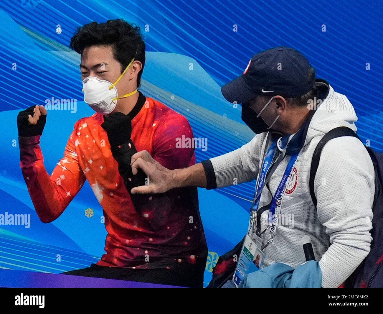 Nathan Chen, left, of the United States, celebrates after winning the ...