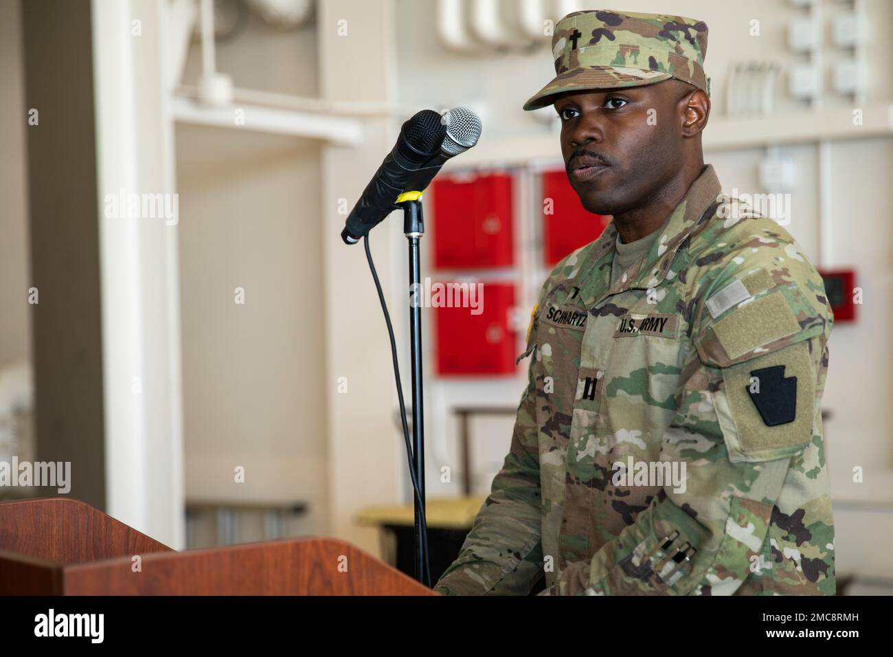 U.S. Army Chaplain Capt. John Schwartz gives an invocation at a change ...