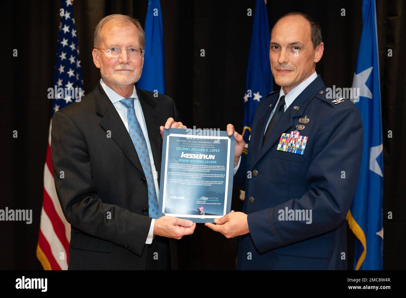 Steven Wert, program executive officer, Digital, presents a certificate ...