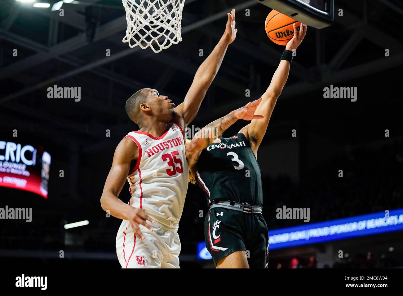 Cincinnati guard Mike Saunders Jr. (3) shoots past Houston's Fabian ...