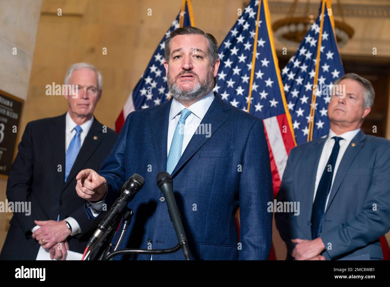 Sen. Ted Cruz, R-Texas, flanked by Sen. Ron Johnson, R-Wis., left, and ...