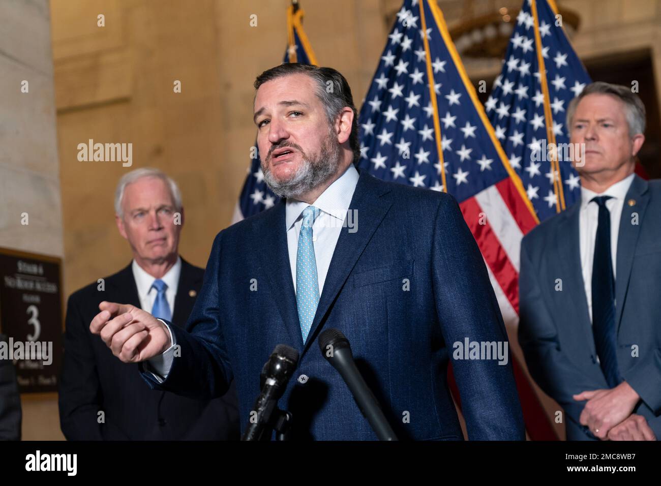 Sen. Ted Cruz, R-Texas, flanked by Sen. Ron Johnson, R-Wis., left, and ...