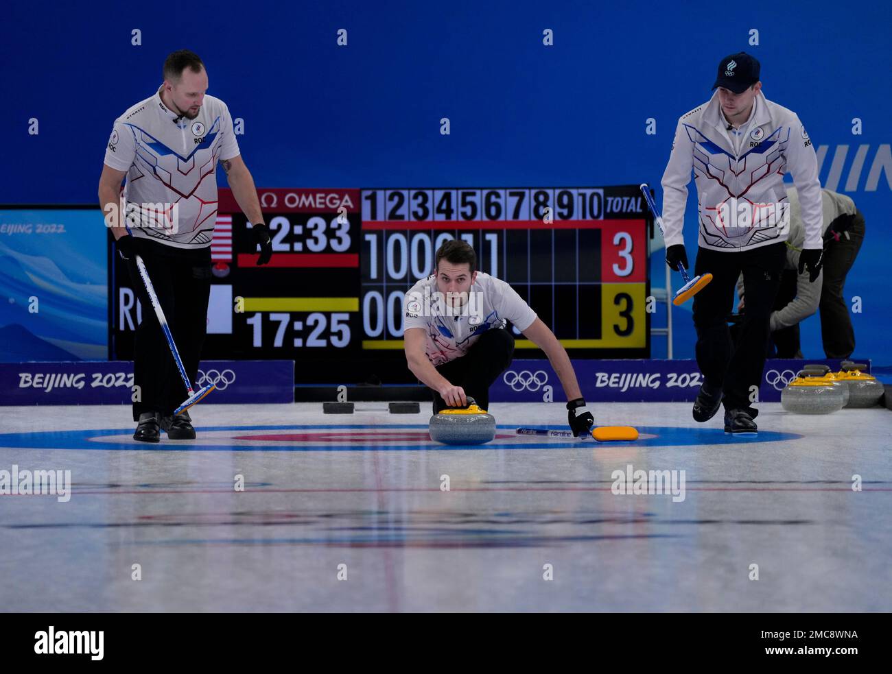 Dmitrii Mironov of the Russian Olympic Committee, throws a rock, during ...