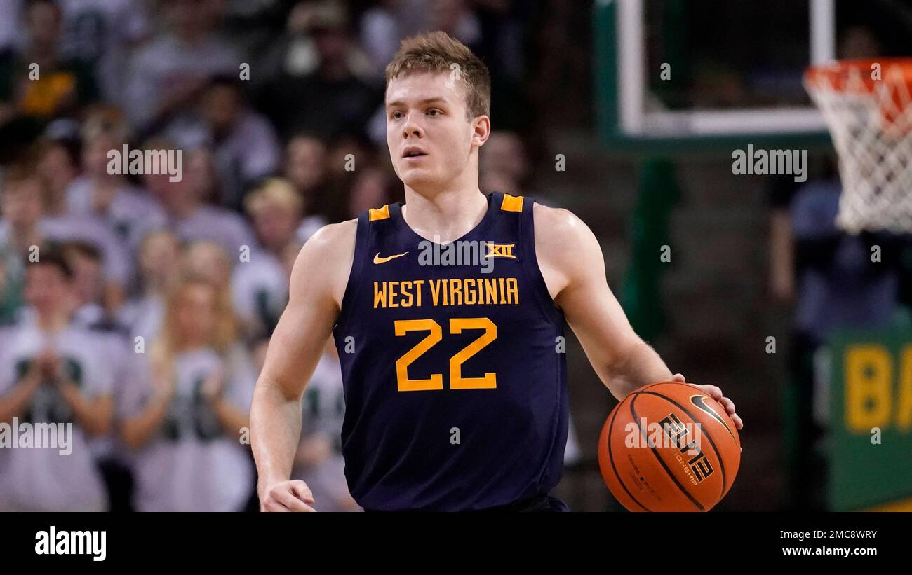 West Virginia guard Sean McNeil handles the ball during an NCAA college ...