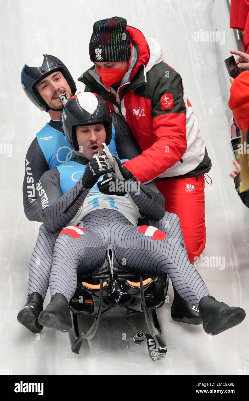 Thomas Steu and Lorenz Koller, of Austria, celebrate in the finish area after the luge doubles ...