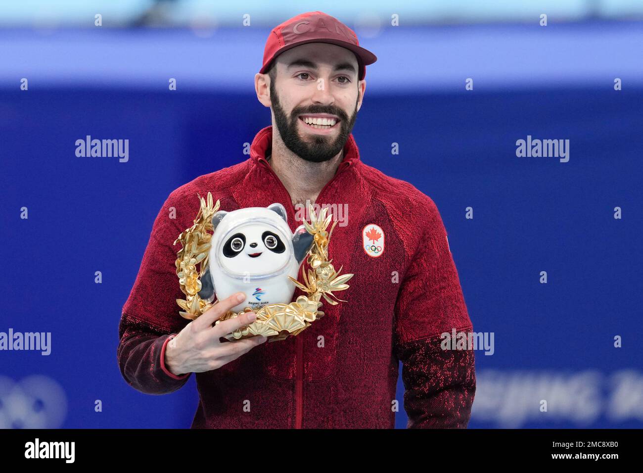 Steven Dubois of Canada, reacts on the podium after his second place ...