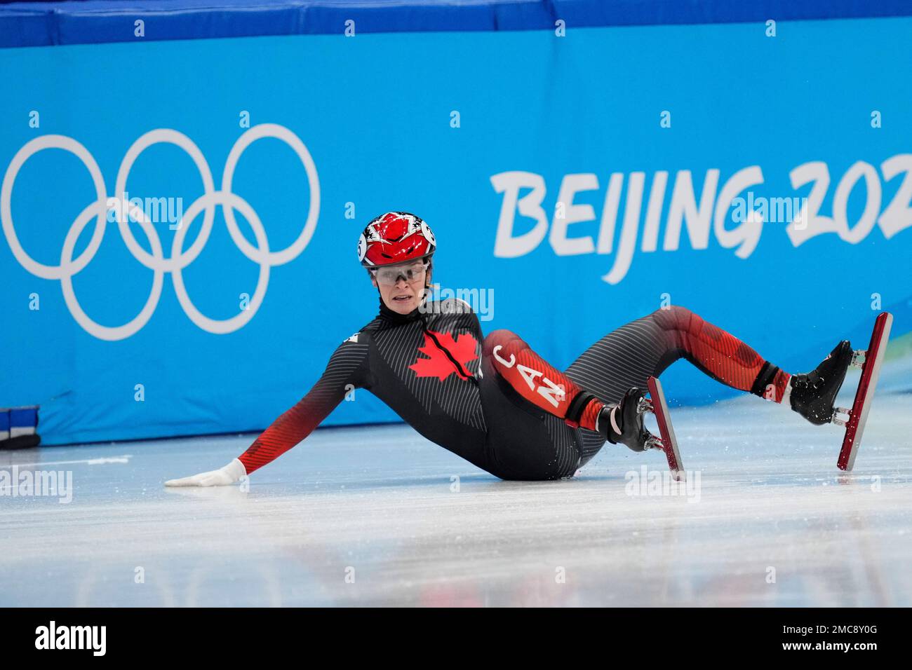 Kim Boutin of Canada, falls in her heat of the women's 1000-meters ...