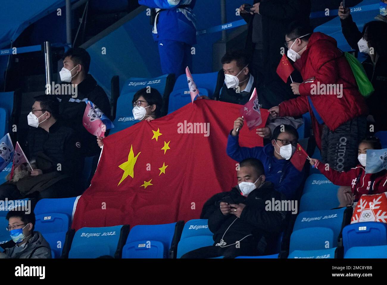 Spectators watch the short track speedskating competition at the 2022 ...