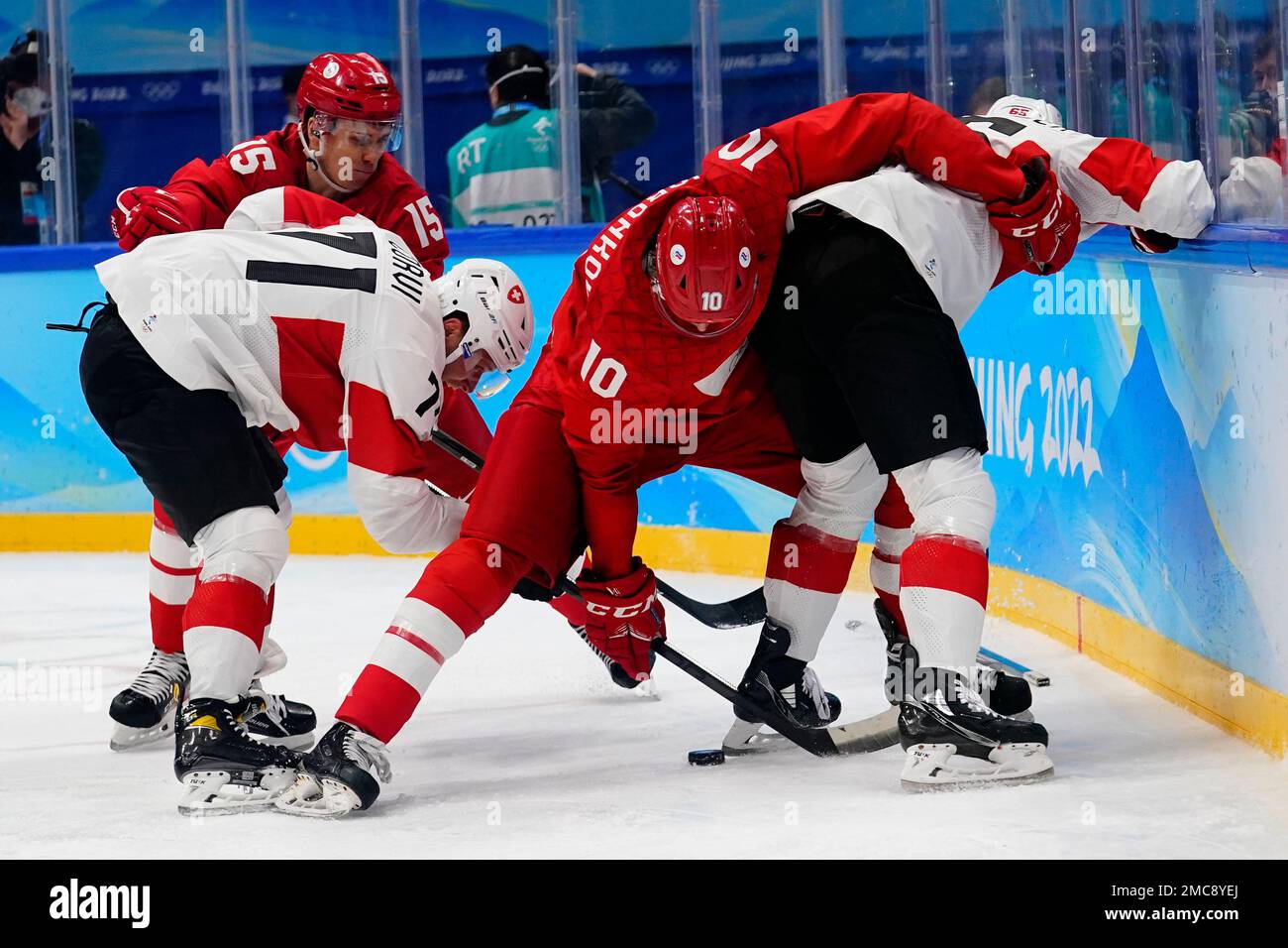 Russian Olympic Committee's Dmitri Voronkov (10) reaches for the puck ...