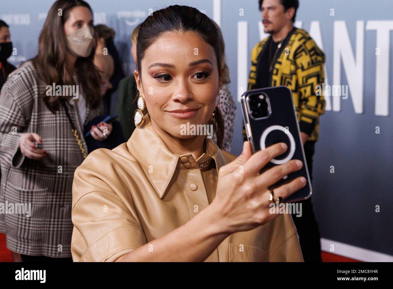 Gina Rodriguez broadcasts live on video for Amazon Prime as she arrives ...