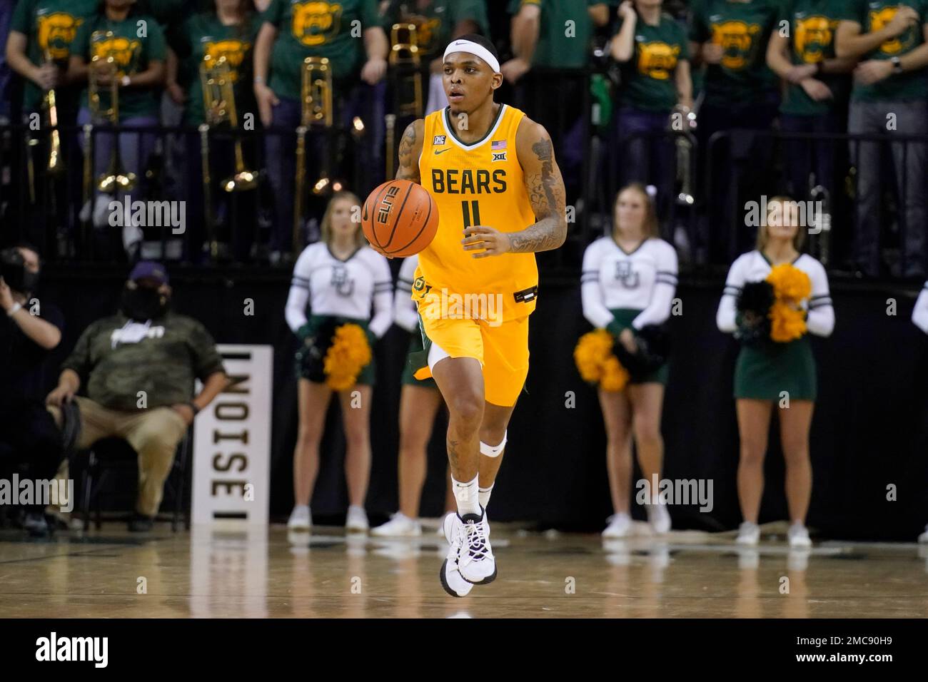 Baylor's James Akinjo advances the ball against West Virginia during an ...