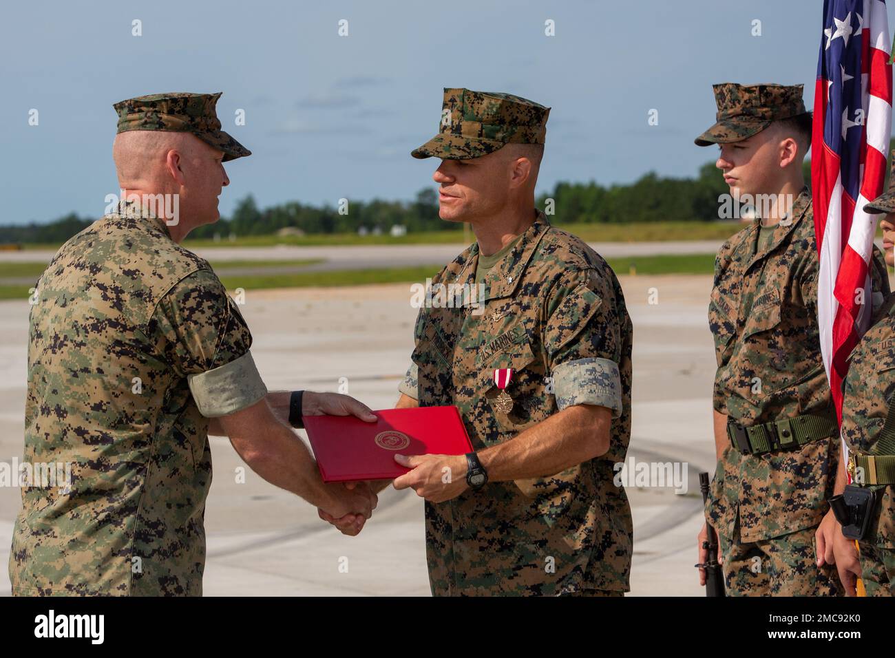 U.S. Marine Corps Col. Curtis V. Ebitz, left, commanding officer of ...