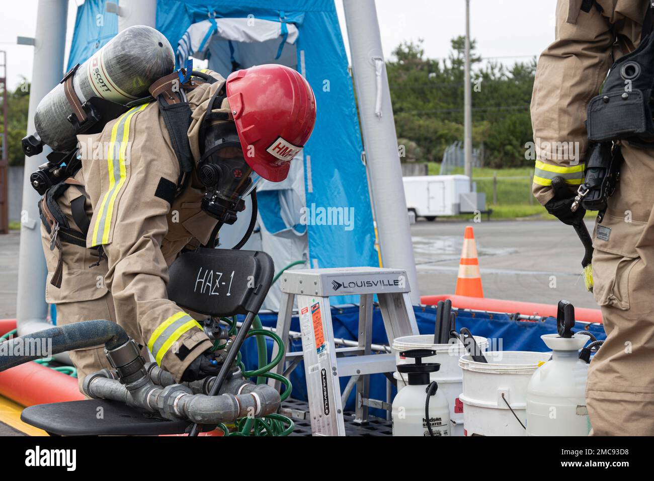 A firefighter with Marine Corps Installations Pacific Fire and ...