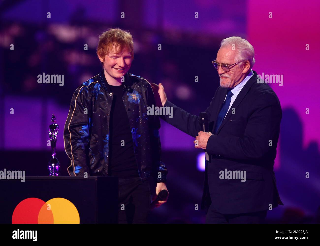 Ed Sheeran on stage with Brian Cox after winning songwriter of the year ...
