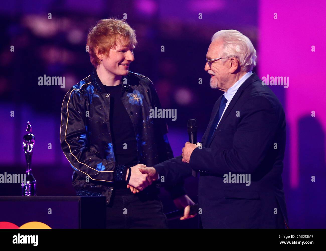 Ed Sheeran on stage with Brian Cox after winning songwriter of the year ...