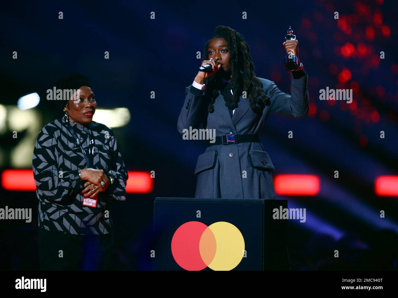 Little Simz on stage with her mum after winning the award for best new ...