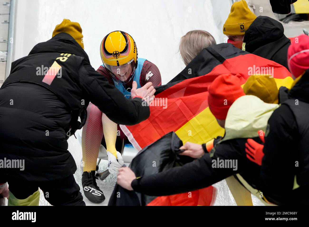 Natalie Geisenberger, of Germany, celebrates with teammates winning the ...