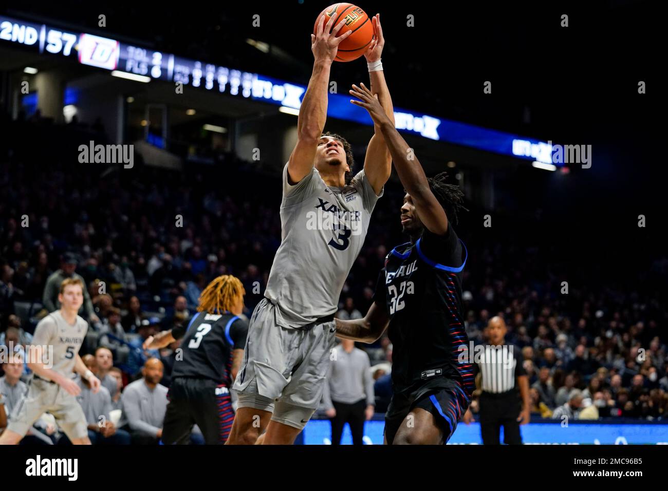 Xavier guard Colby Jones (3) shoots past DePaul's David Jones (32 ...