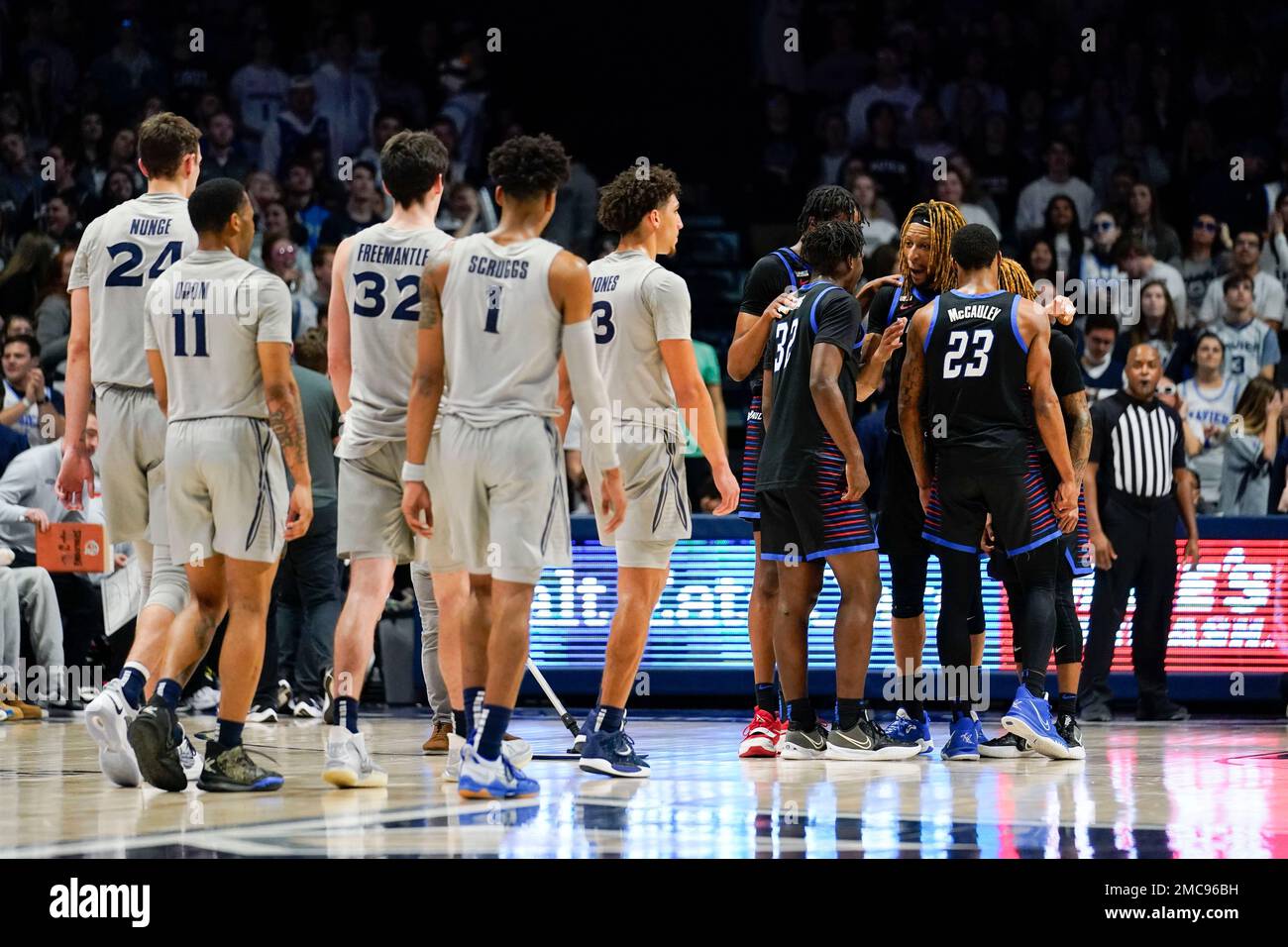 DePaul players huddle during a timeout during the second half of an ...