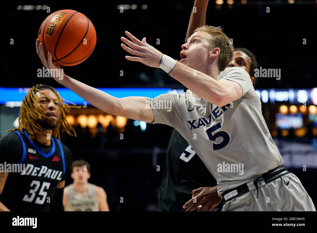 Xavier guard Adam Kunkel (5) shoots during the first half of an NCAA ...