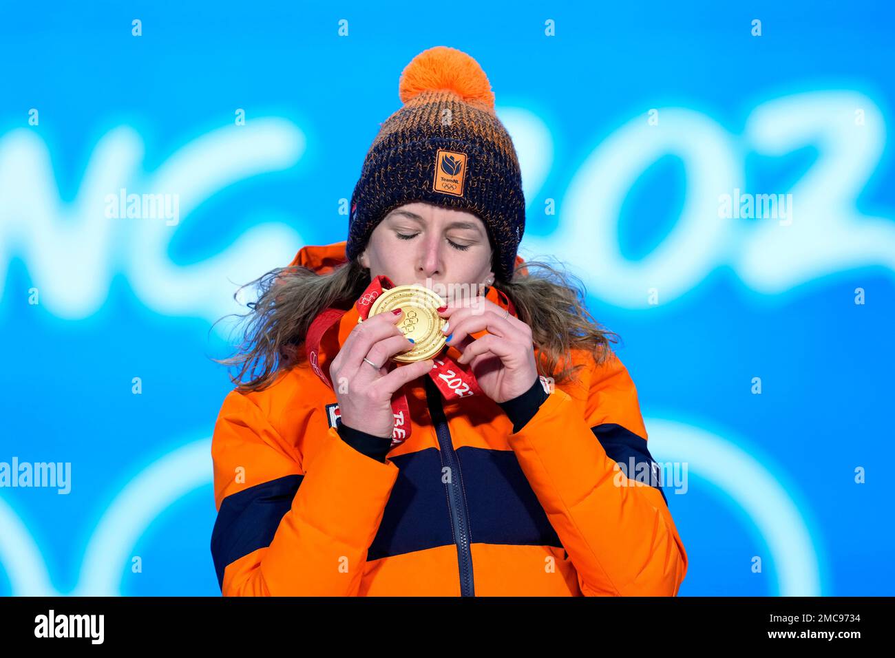 Ireen Wust of the Netherlands kisses her gold medal during a medal ...