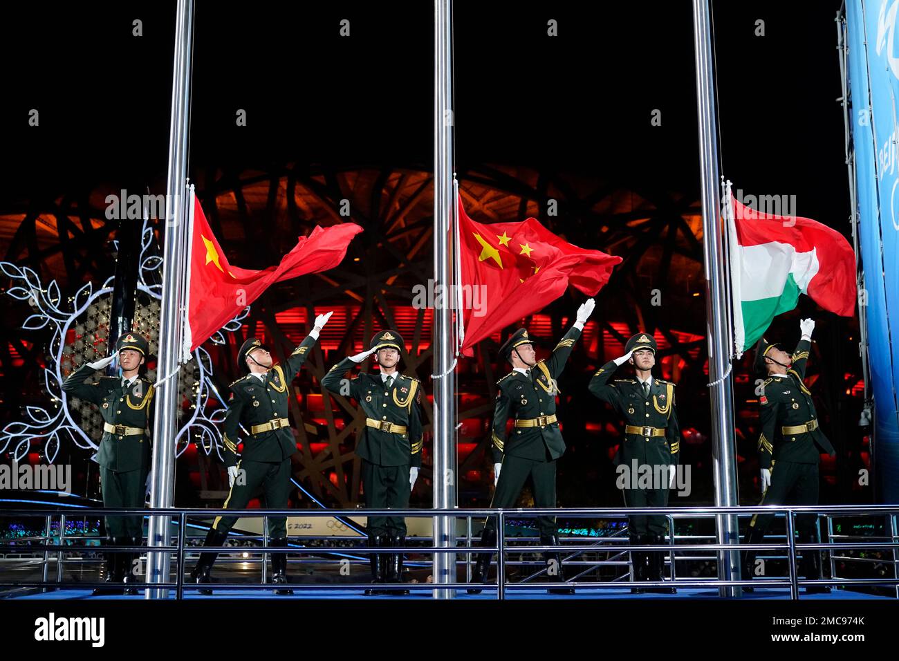 Members of a color guard raise Chinese and Hungary flags during a medal ...