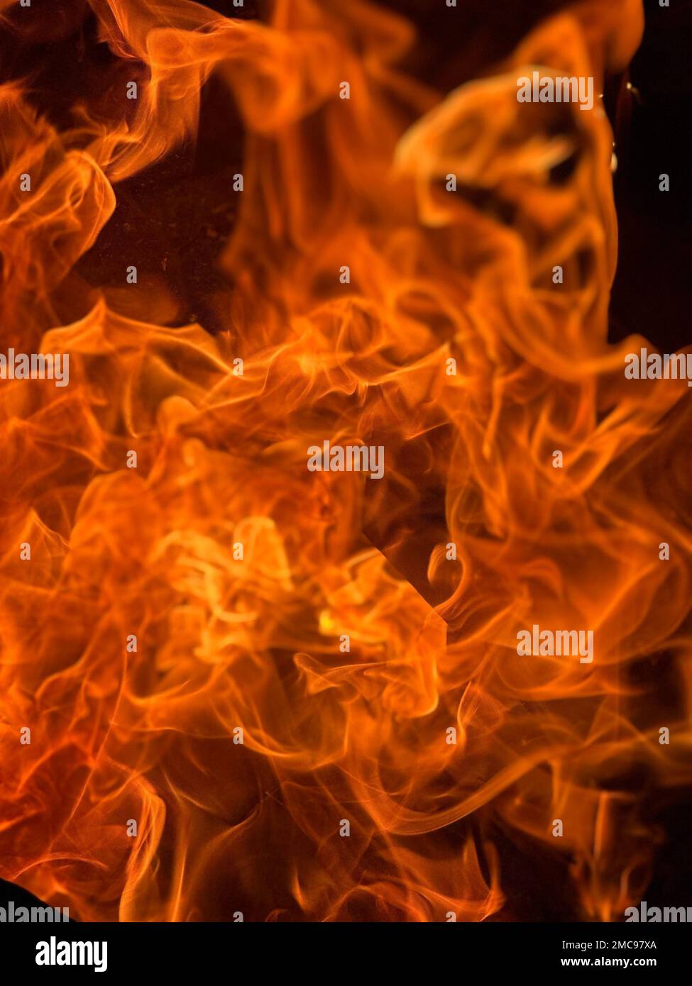 A vertical shot of a burning blaze of fire flame, best for background ...