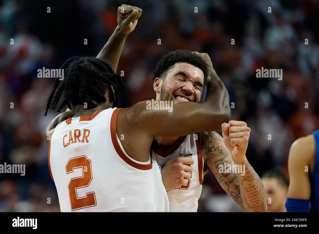 Texas guard Marcus Carr (2) and Texas forward Timmy Allen, right ...