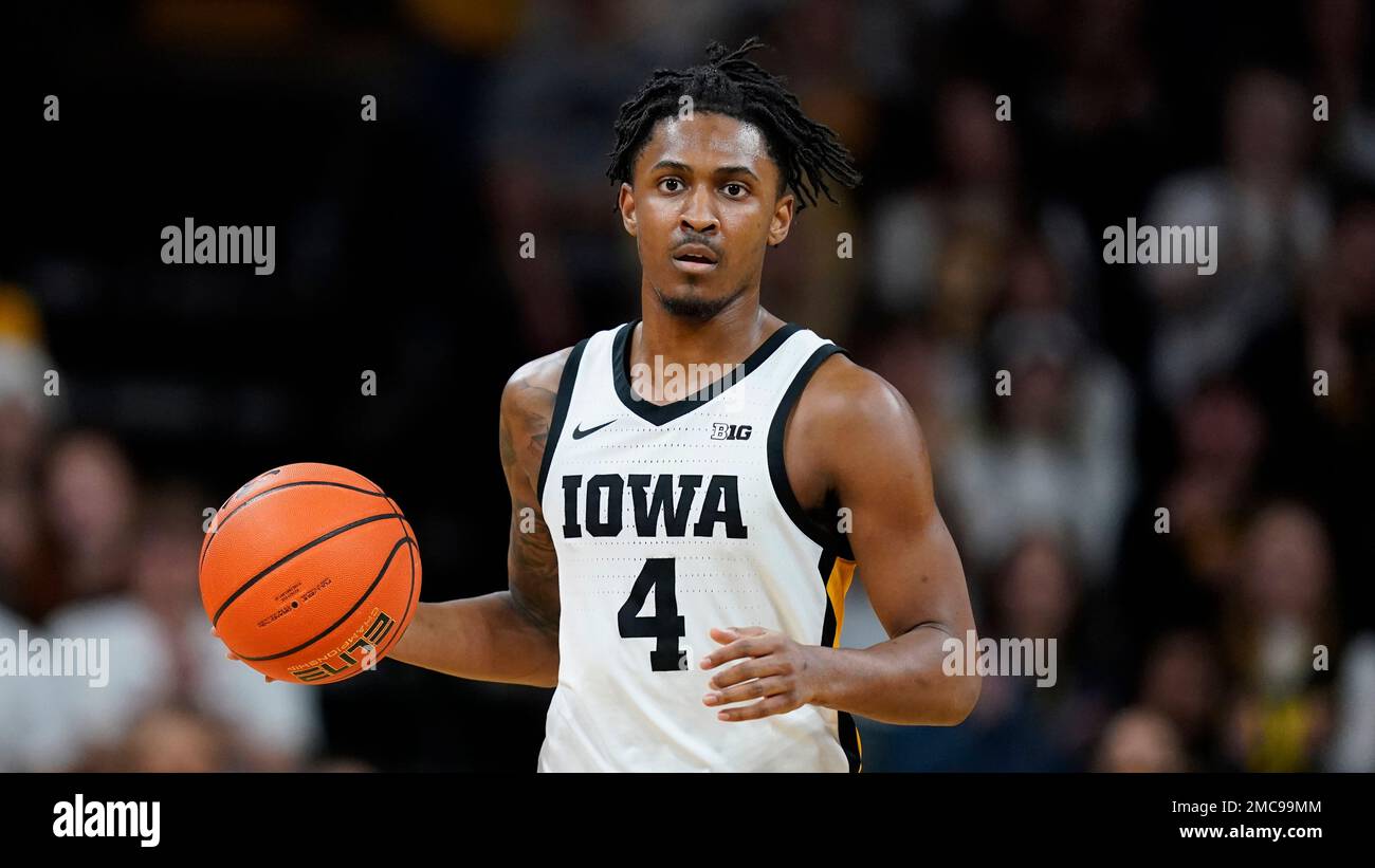 Iowa guard Ahron Ulis (4) drives up court during an NCAA college ...