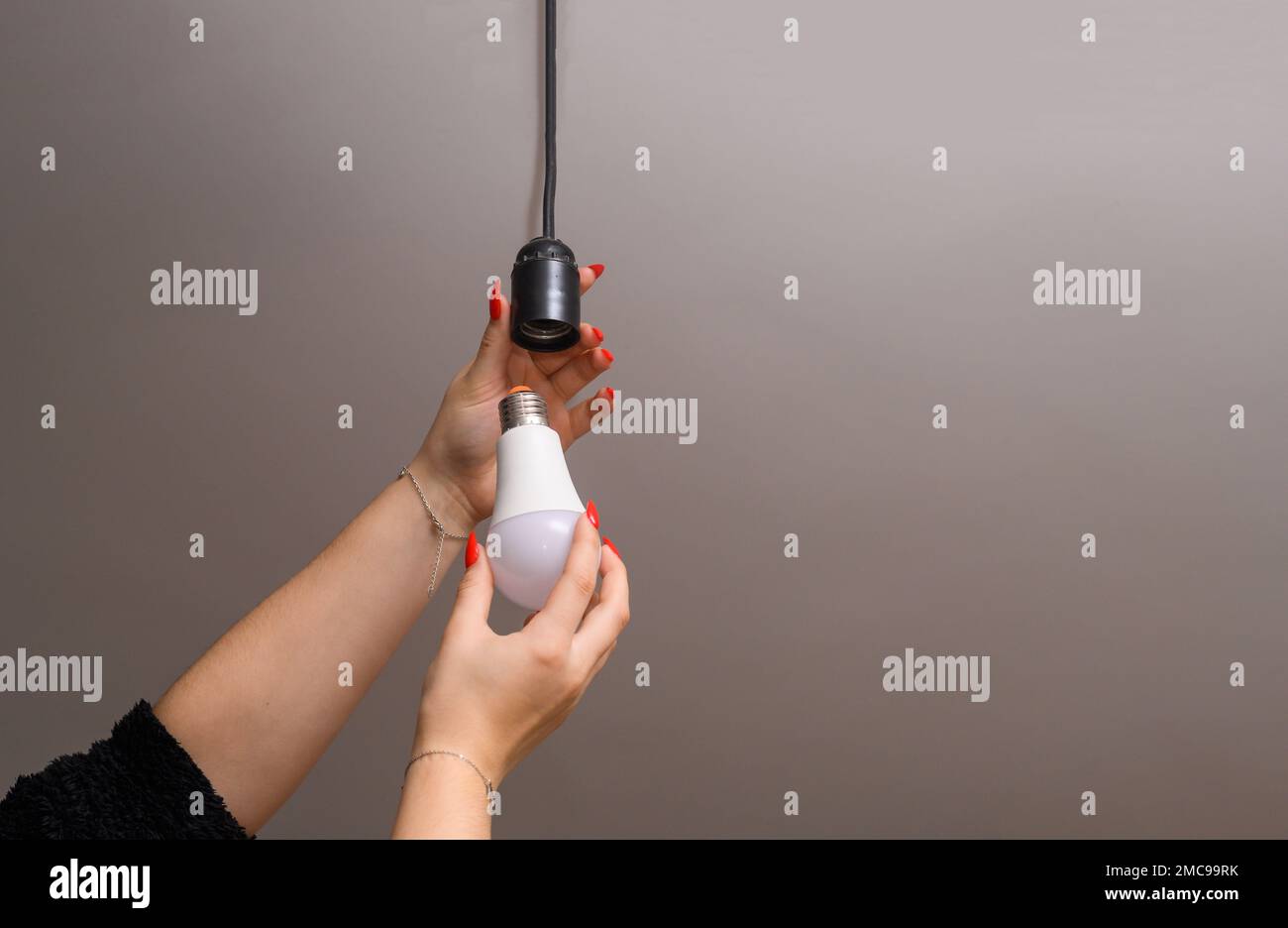 installation of an LED lamp. Energy saving Stock Photo - Alamy