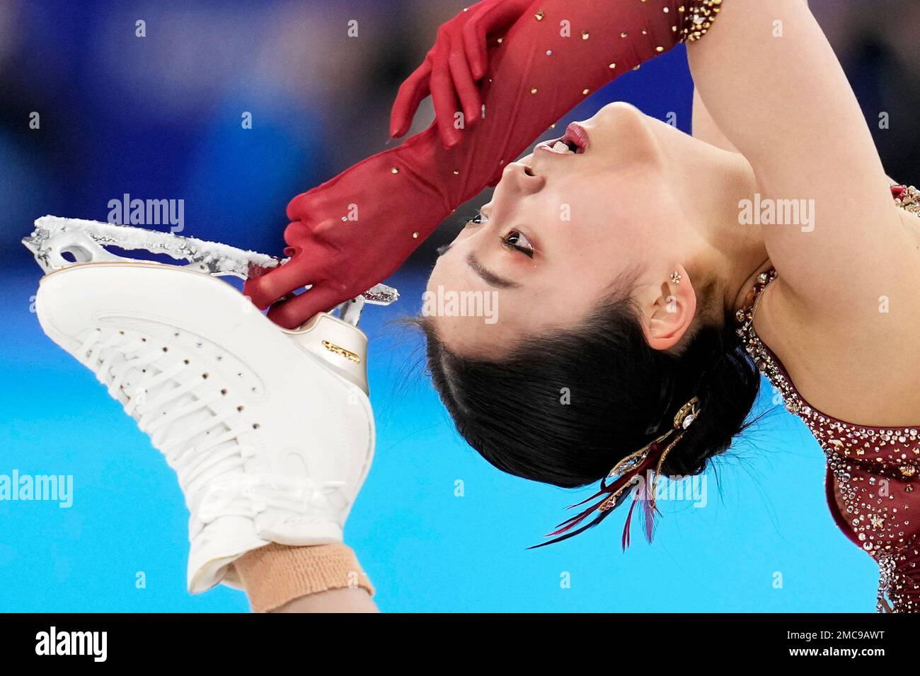Zhu Yi, of China, competes in the women's team free skate program ...