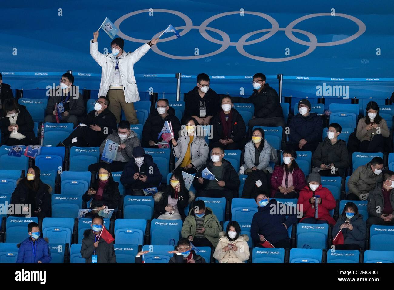Spectators watch the men's short program figure skating competition at ...