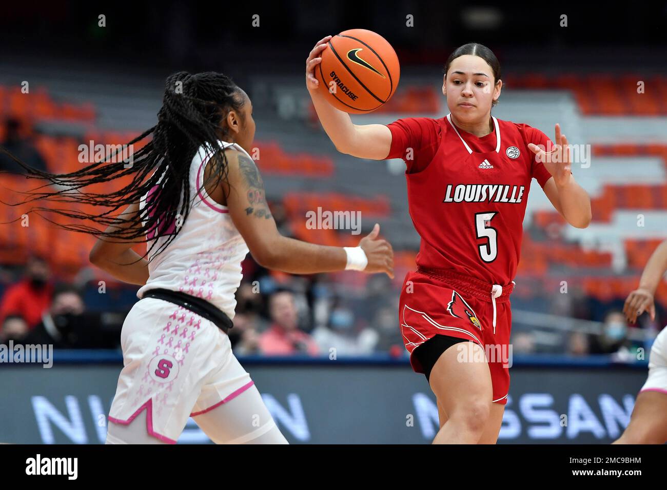 Louisville guard Mykasa Robinson, right, reaches for the ball against ...