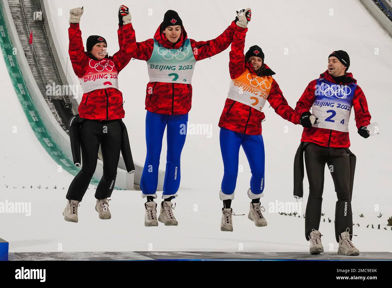 Canada's Alexandria Loutitt, left, celebrates with teammates Matthew ...