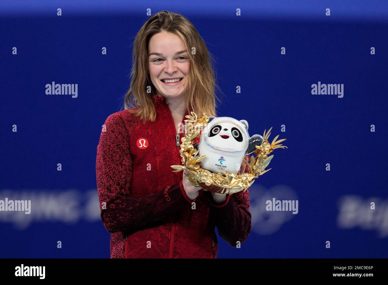 Bronze medalist, Kim Boutin, of Canada, reacts on the podium during the ...
