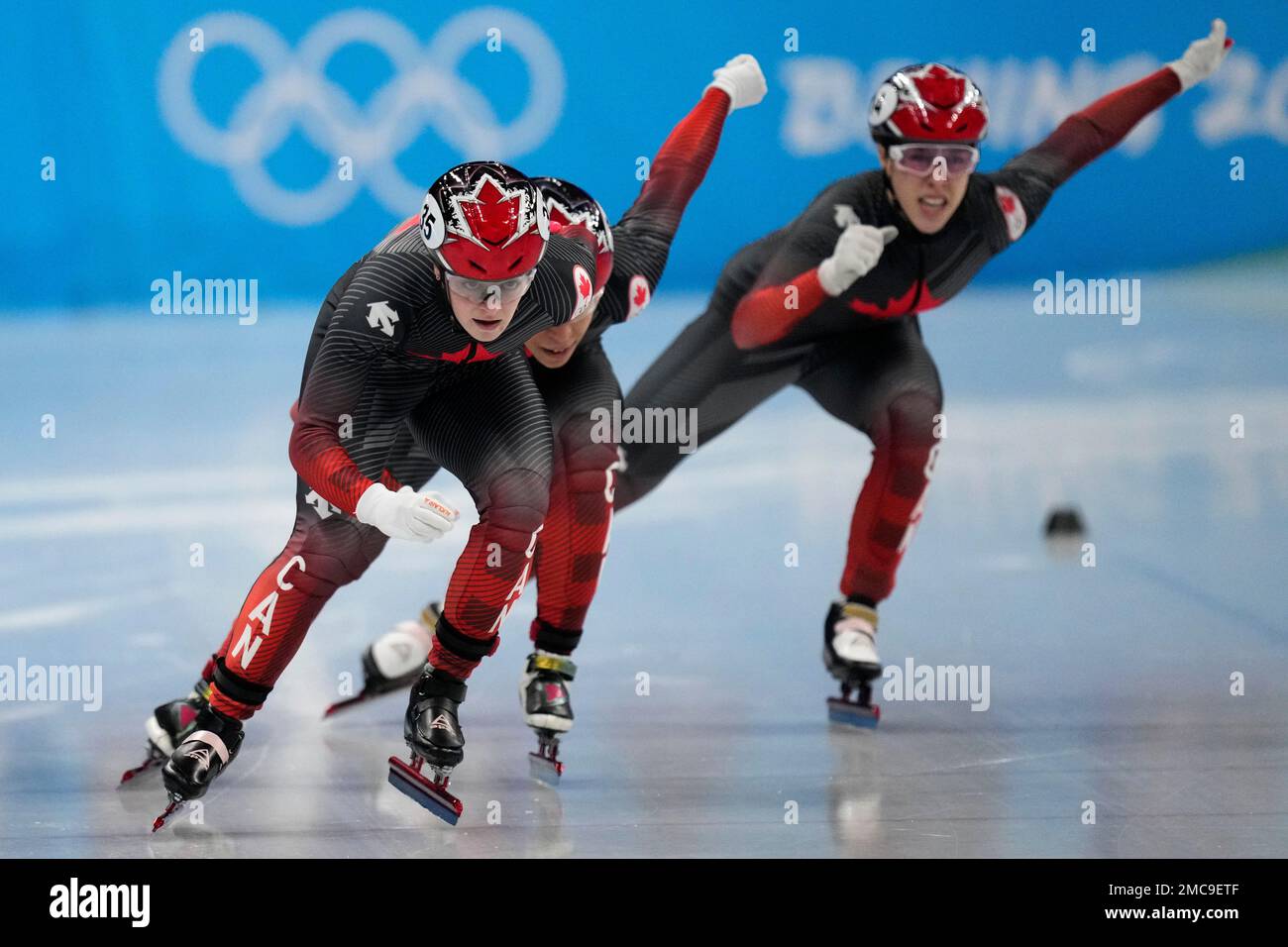 Kim Boutin, left, of Canada, races in her quarterfinal of the women's ...