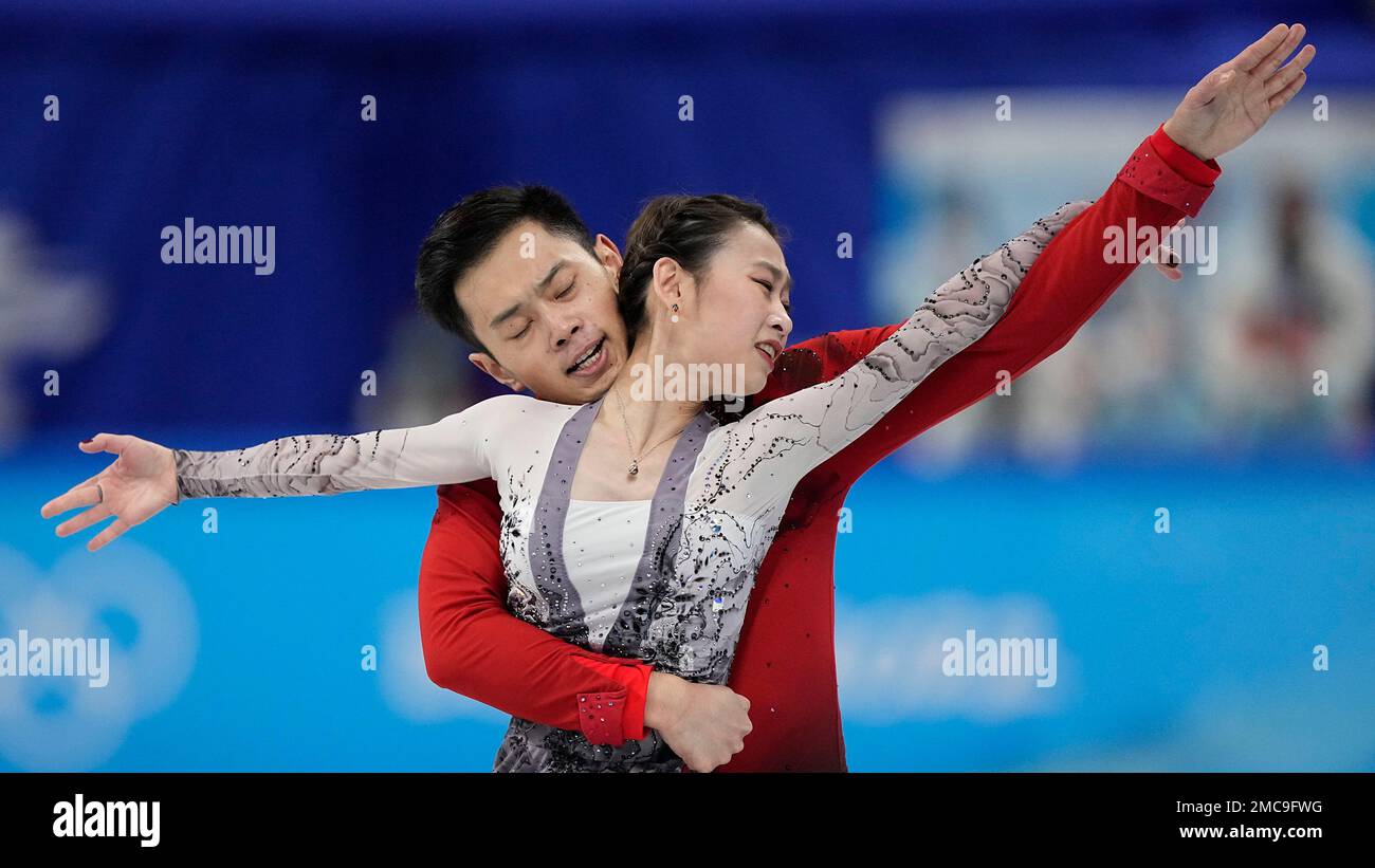 Peng Cheng and Jin Yang, of China, compete in the pairs team free skate ...