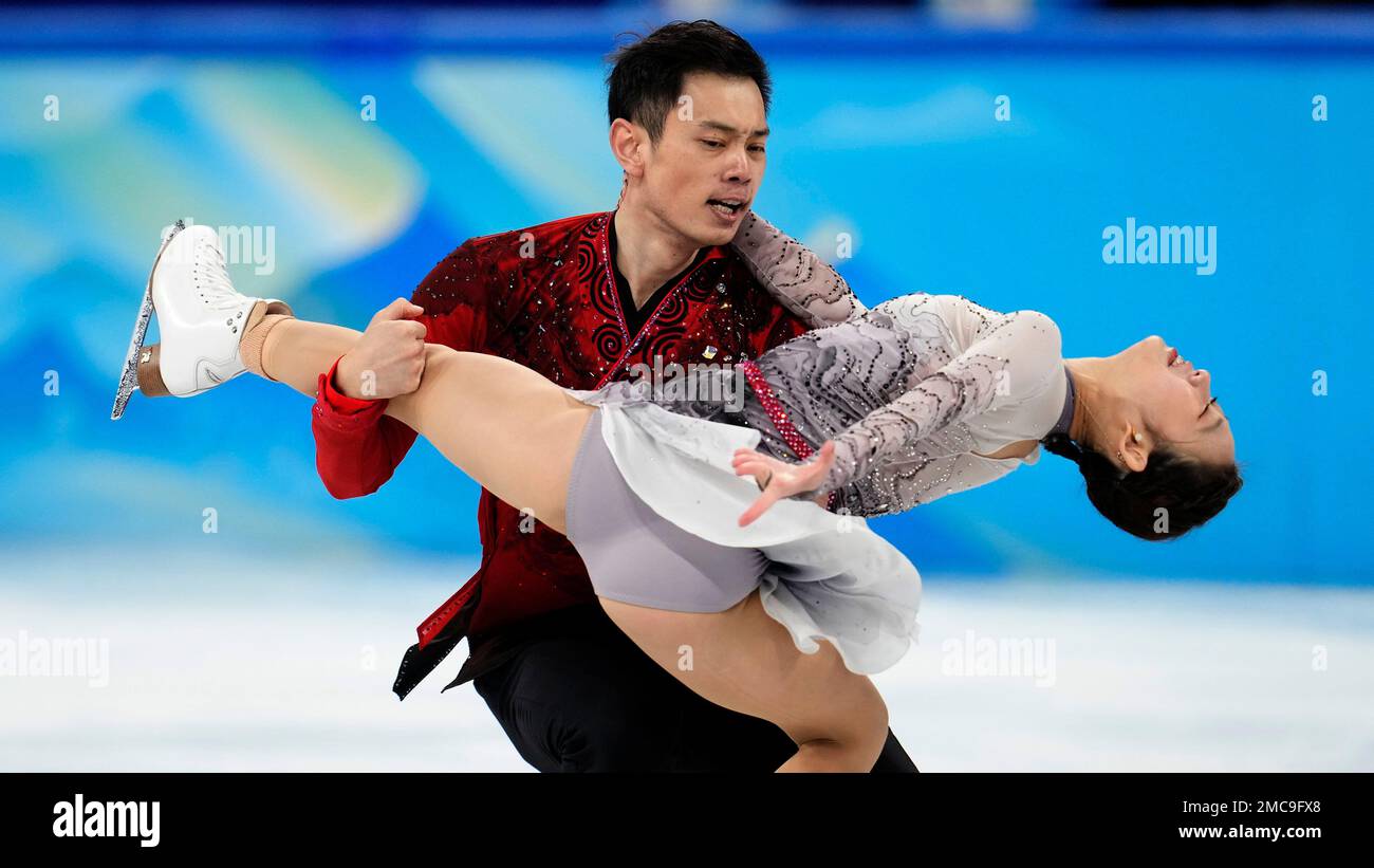 Peng Cheng and Jin Yang, of China, compete in the pairs team free skate ...