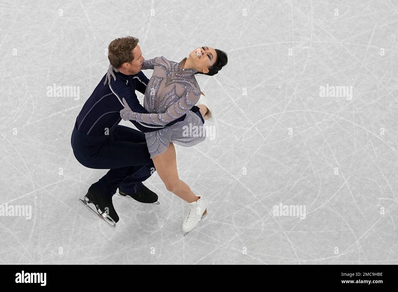 Madison Chock and Evan Bates, of the United States, compete in the team ...