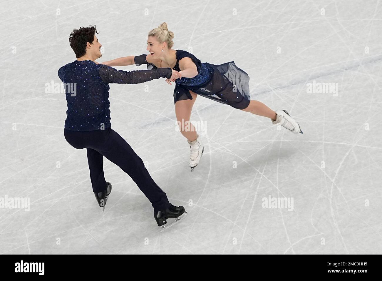Piper Gilles and Paul Poirier, of Canada, compete in the team ice dance ...