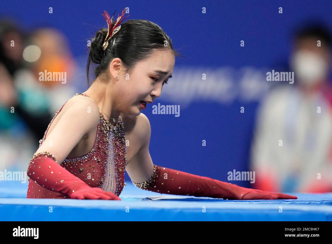 Zhu Yi, of China, reacts after the women's team free skate program ...
