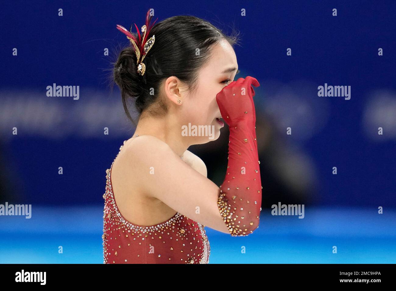 Zhu Yi, of China, reacts after the women's team free skate program ...