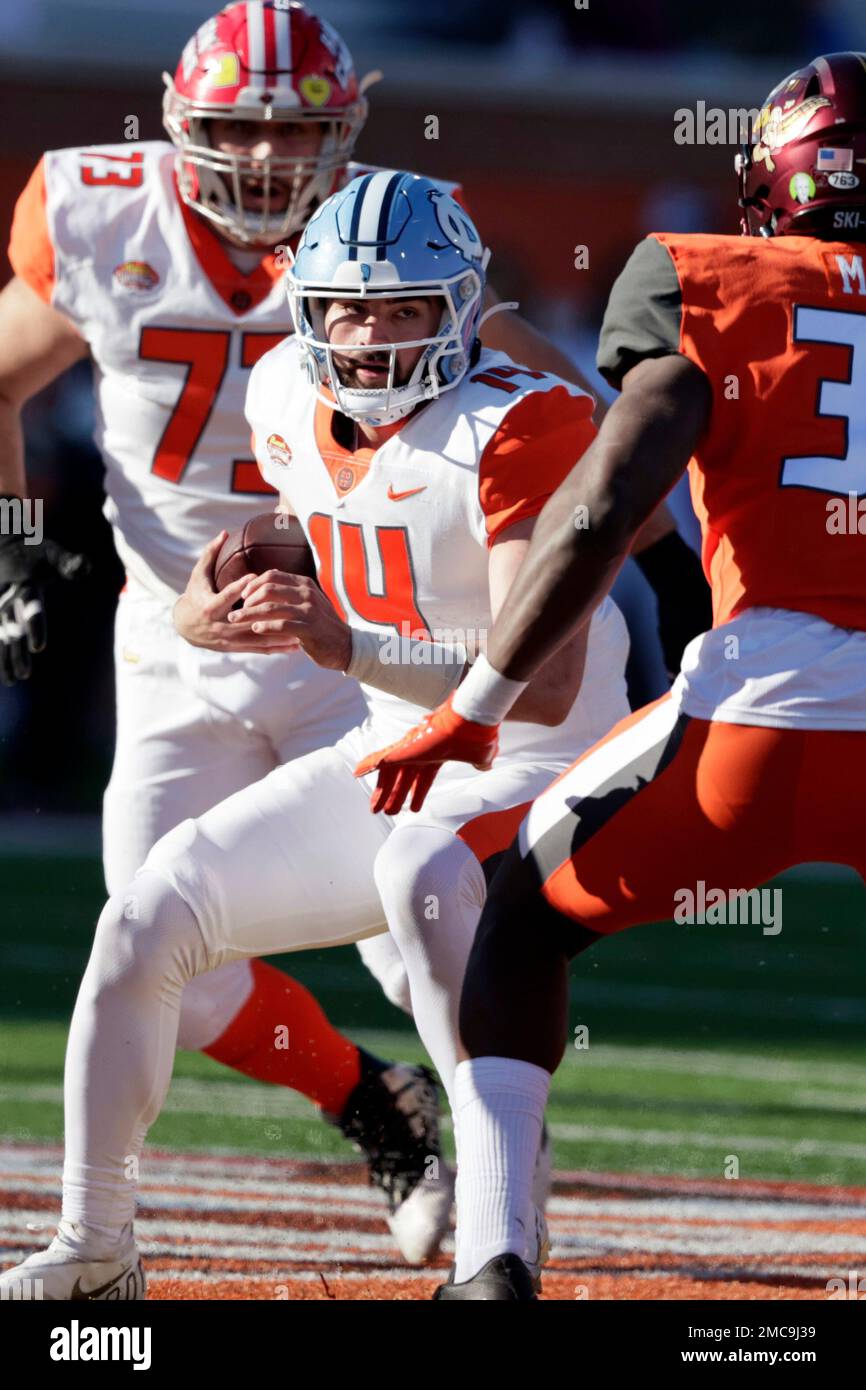American Team quarterback Sam Howell of North Carolina (14) carries the ...