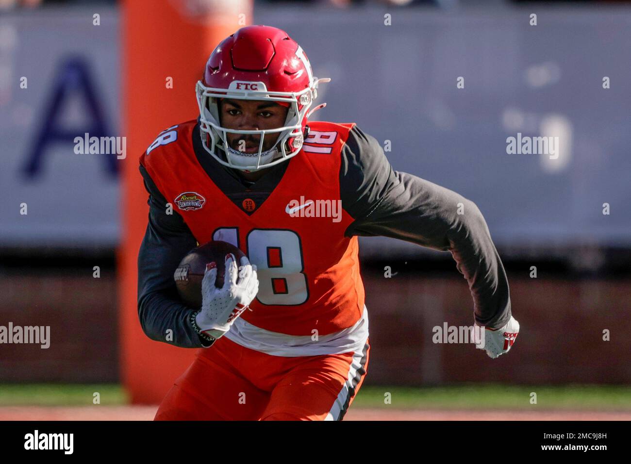 National Team wide receiver Bo Melton of Rutgers (18) carries the ball ...