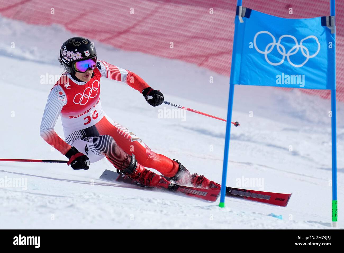 Asa Ando of Japan makes a turn during the first run of the women's ...