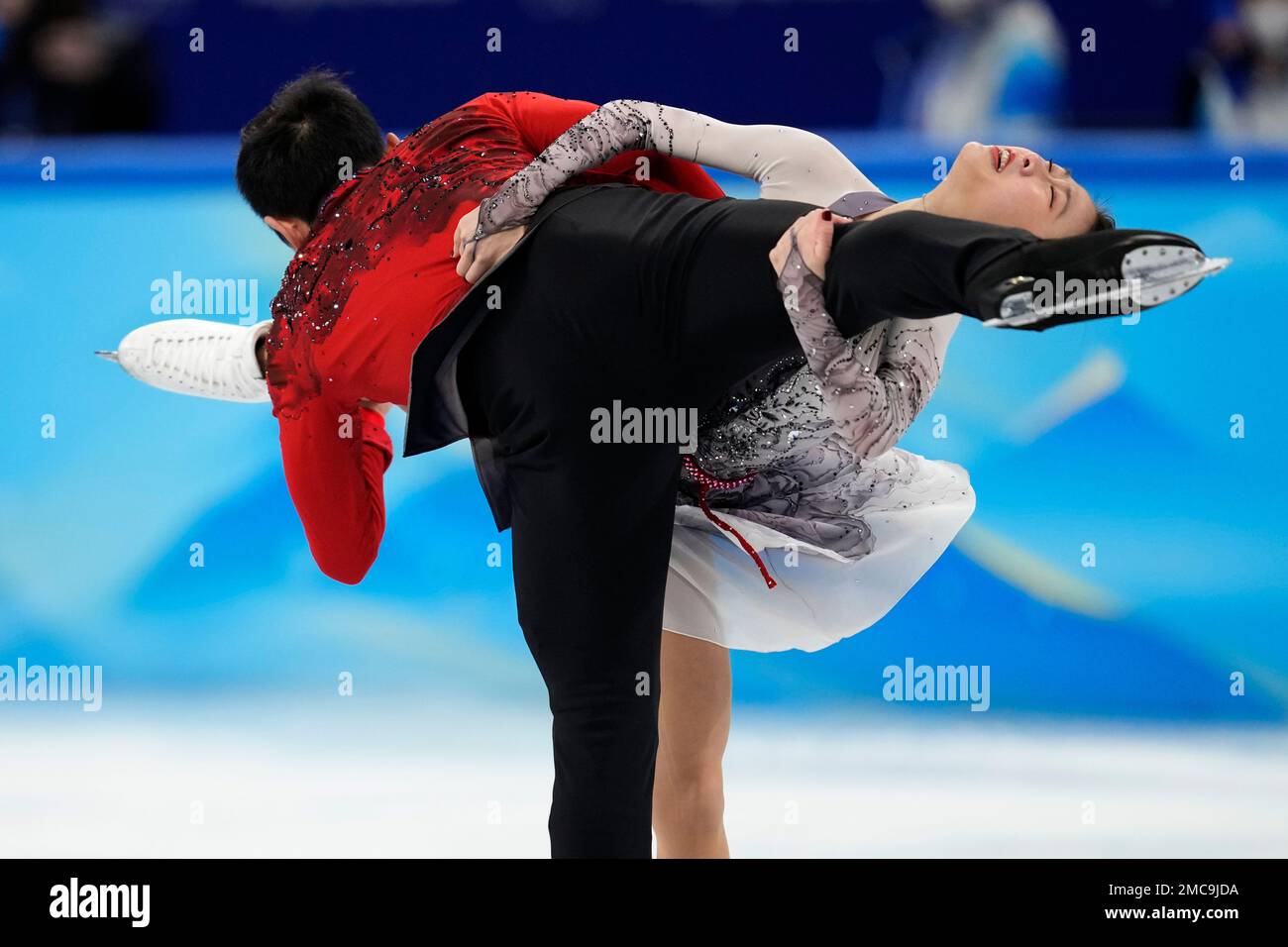 Peng Cheng and Jin Yang, of China, compete in the pairs team free skate ...